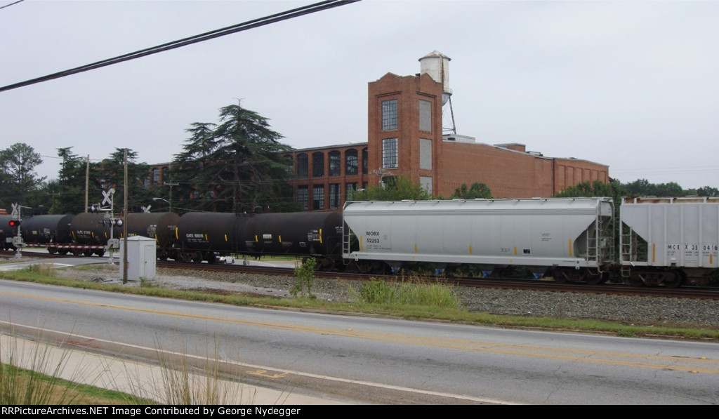 NS: mixed freight train passing a former textile mill / Arcadia Heights